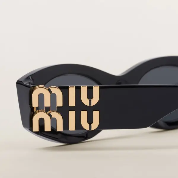 Miu Miu Cat Eye Sunglasses With Logo Detail - Black/gray