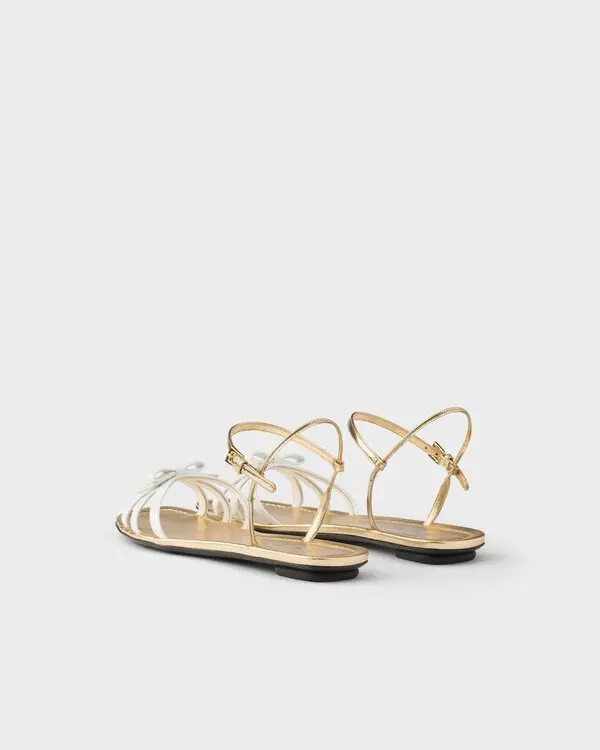 Prada Flat Patent And Metallic Leather Sandals With Bow Detailing