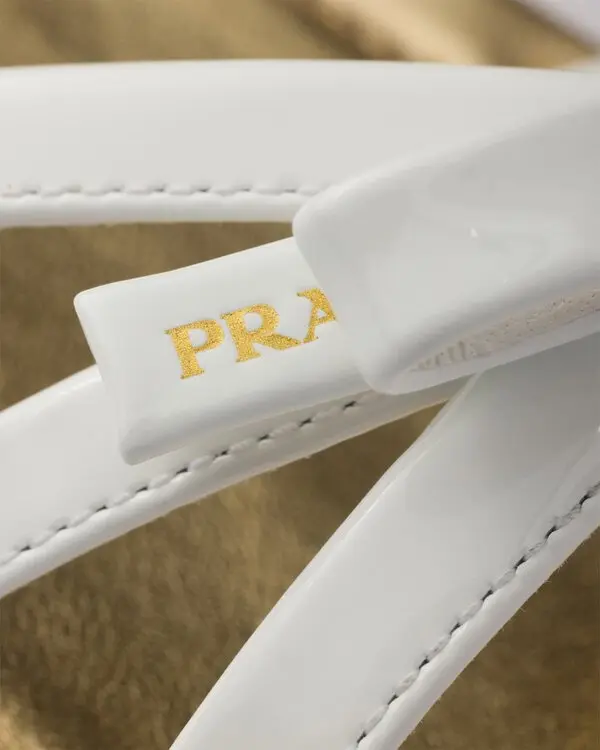 Prada Flat Patent And Metallic Leather Sandals With Bow Detailing