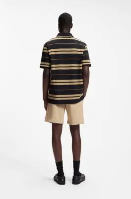 Hugo Regular-fit Polo In Cotton Pique With Engineered Stripes