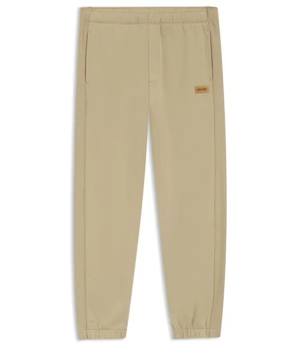 Hugo Cotton-terry Sweatpants With Logo Badge - Beige