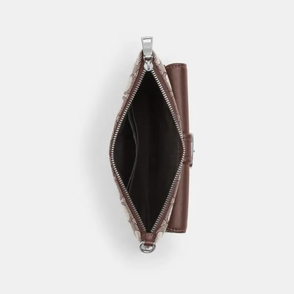 COACH OUTLET Coach Signature Jacquard Wristlet With Leather Accents - Silver/oak/maple
