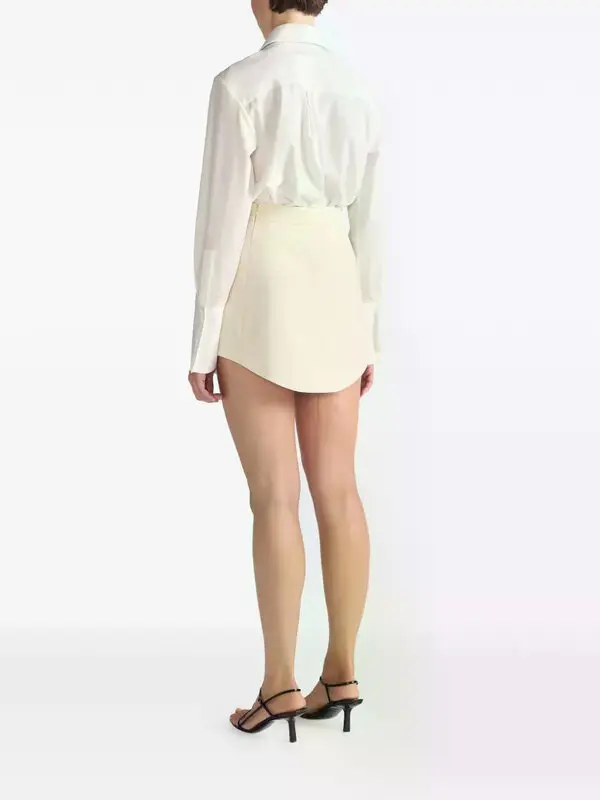 THE ARKOW Rose Curved Hem Mini Skirt
