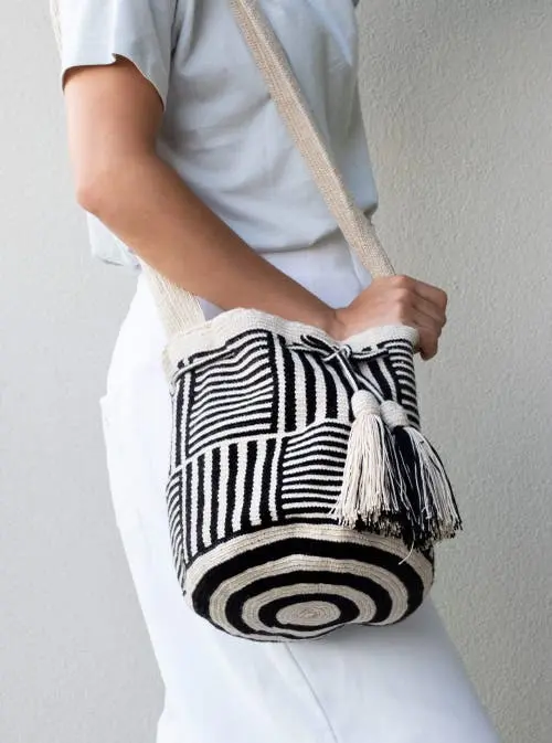 ONE THREAD COLLECTIVE Kululu Bag Crocheted Crossbody With Tassel Detail