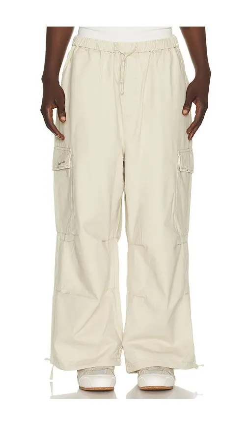 DRMERS CLUB Smiley Logo Parachute Pants In Cream - Light Beige