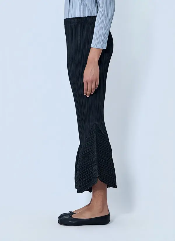 Issey Miyake Mid Rise Flared Pleated Trousers