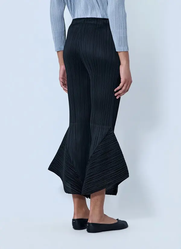 Issey Miyake Mid Rise Flared Pleated Trousers