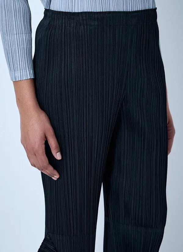 Issey Miyake Mid Rise Flared Pleated Trousers