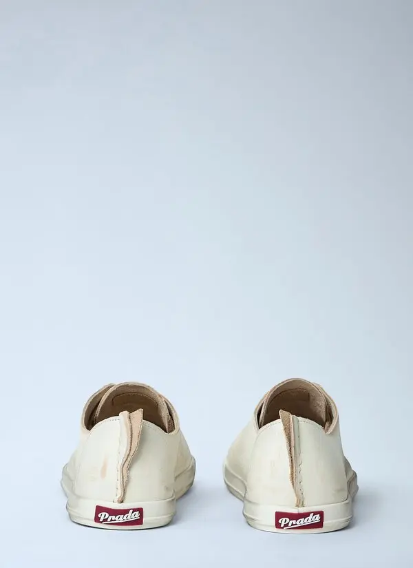 Prada Distressed Leather Lace-up Sneakers - White
