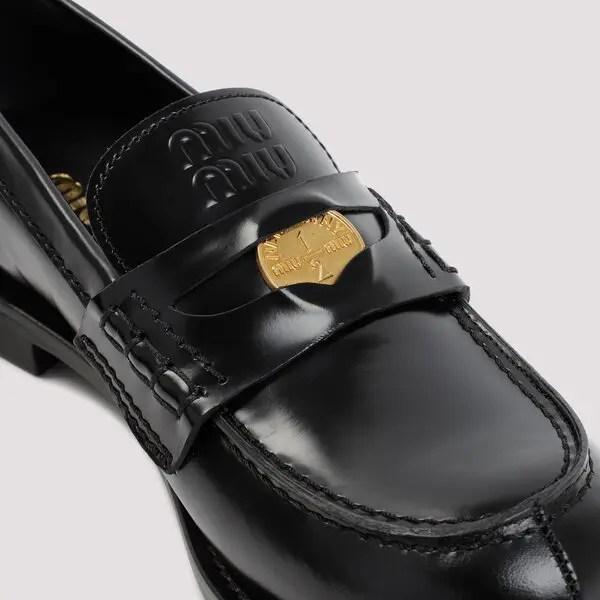 Miu Miu Leather Loafers With Metal Plaque - Black