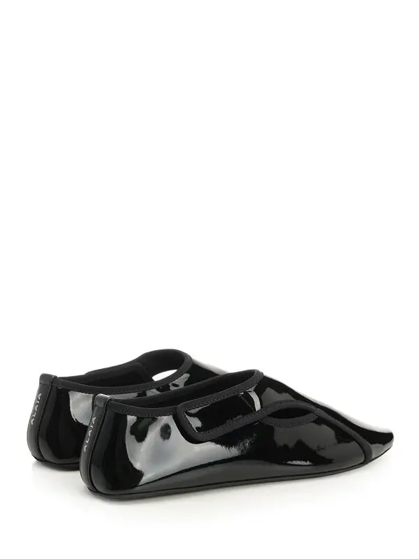 Alaïa Patent Slippers With Logo Detail