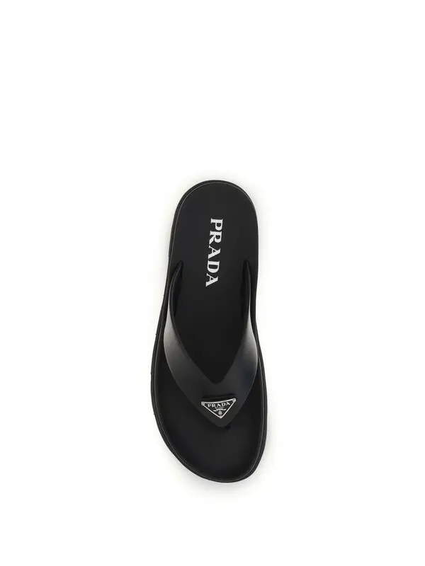 Prada Leather Flip-flop Sandals With Metal Triangle Logo