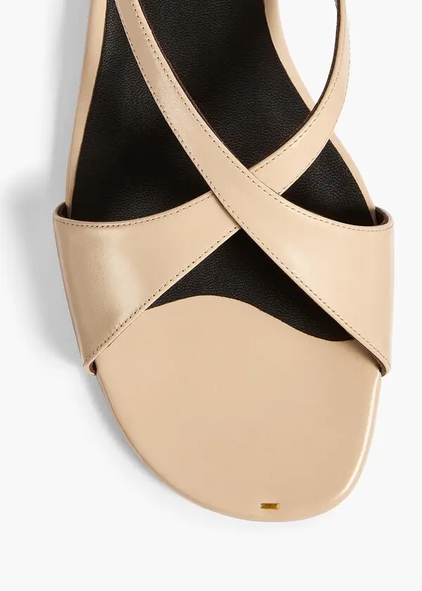 Khaite Liria Glazed Leather Ankle Strap Flat Sandals - Nude