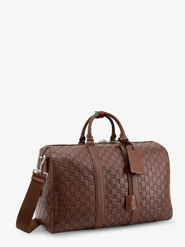 gucci men women's handbag travel bag duffle bag Pebbled Leather Bamboo Top Handle Suitcase - Luxury Used Designer Bags This lightweight GG canvas duffle bag is complete with leather trim for a refined touch Gucci GG Supreme carry-on duffle