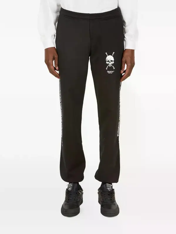 DEATH CIGARETTES Skull Logo Print Trousers - Black