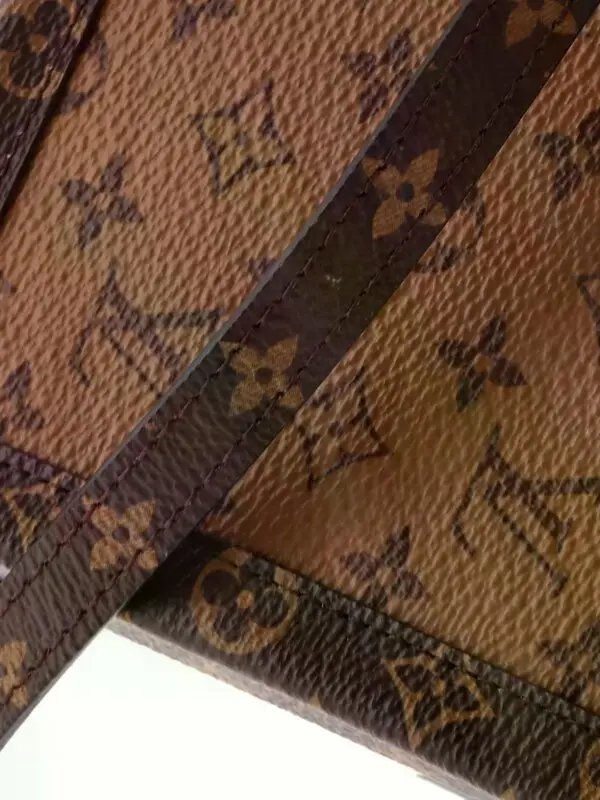 LOUIS VUITTON Vertical Trunk Pochette Crossbody Bag