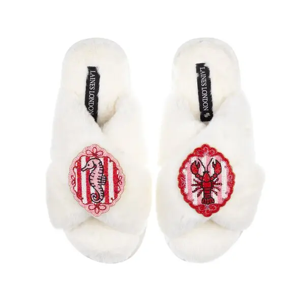 LAINES LONDON Faux Fur Cross Strap Slippers With Embroidered Seahorse And Lobster Brooches - White