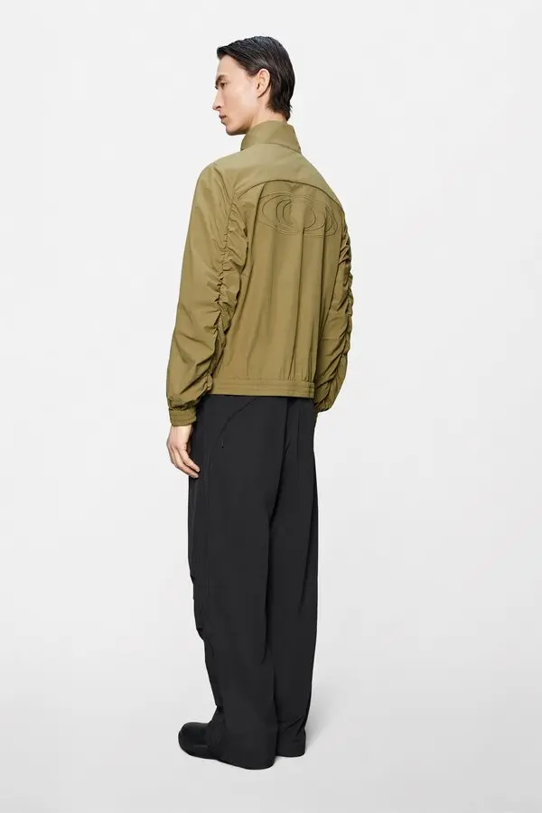 Rains Cooldown Track Top With Ruching Detail And Embroidery