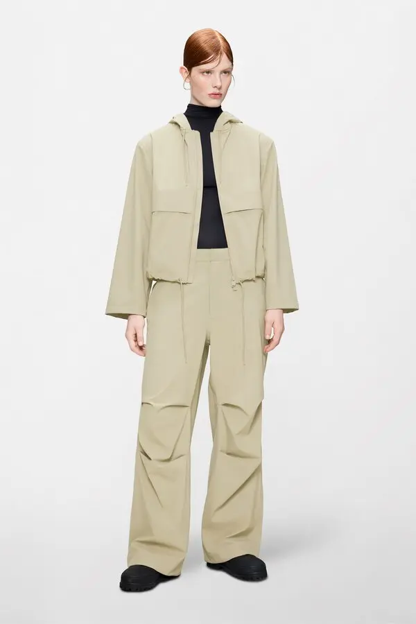 Rains Suva Hardshell Cropped Jacket With Drawstring Hood And Zip Pockets - Beige