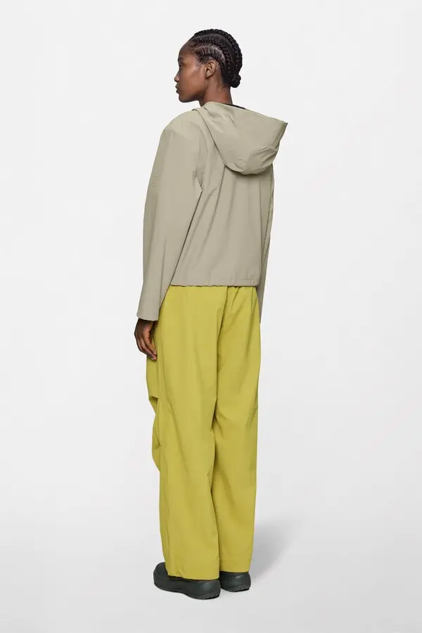 Rains Suva Hardshell Cropped Jacket With Drawstring Hood And Zip Pockets - Beige