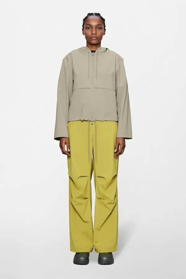 Rains Suva Hardshell Cropped Jacket With Drawstring Hood And Zip Pockets - Beige