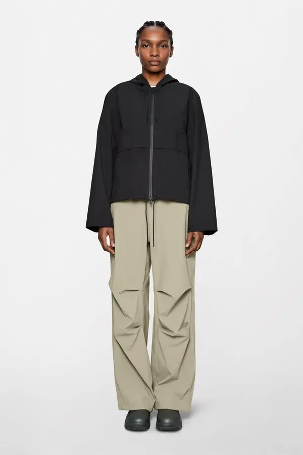 Rains Suva Hardshell Cropped Jacket With Drawstring Hood And Zip Pockets - Black
