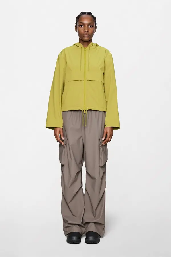 Rains Suva Hardshell Cropped Jacket With Drawstring Hood And Zip Pockets - Glow