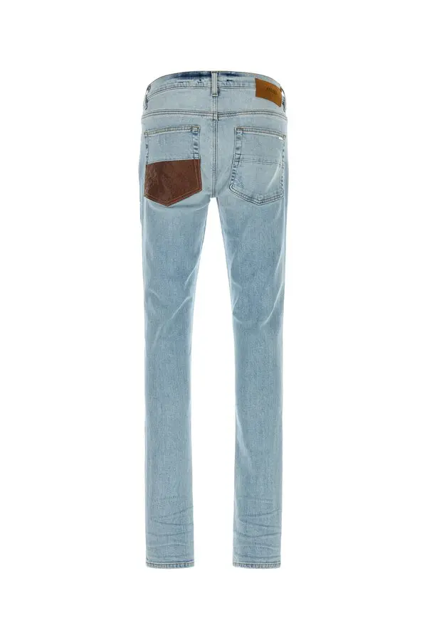 Amiri Distressed Stonewashed Stretch Denim Jeans