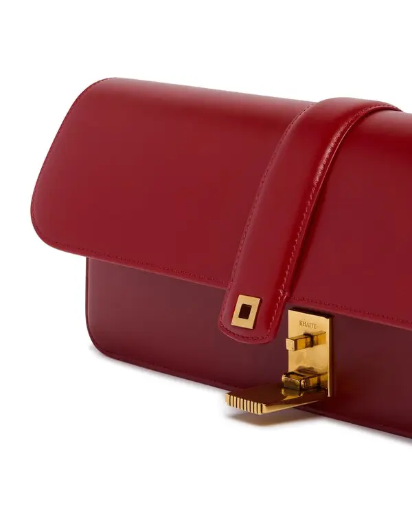 Khaite Polished Leather Clutch Bag With Gold-tone Clasp - Red