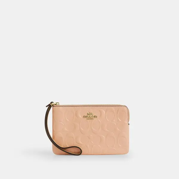 COACH OUTLET Corner Zip Wristlet In Signature Leather With Charm - Gold/faded Blush