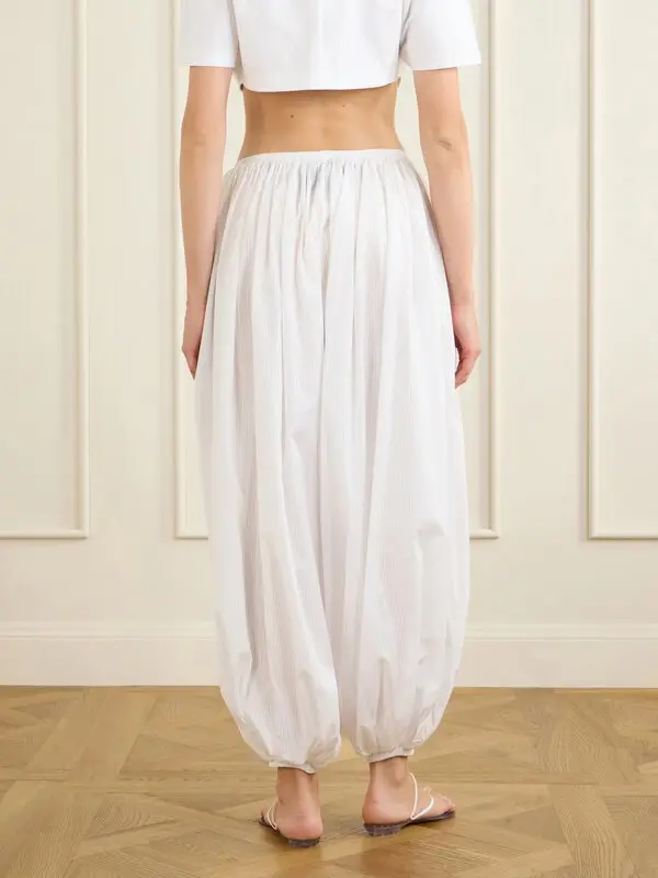 Alaïa Striped Cotton-poplin Tapered Pants