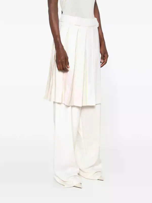 VESTIAIRE D'UN OISEAU LIBRE Pleated Layered Trousers