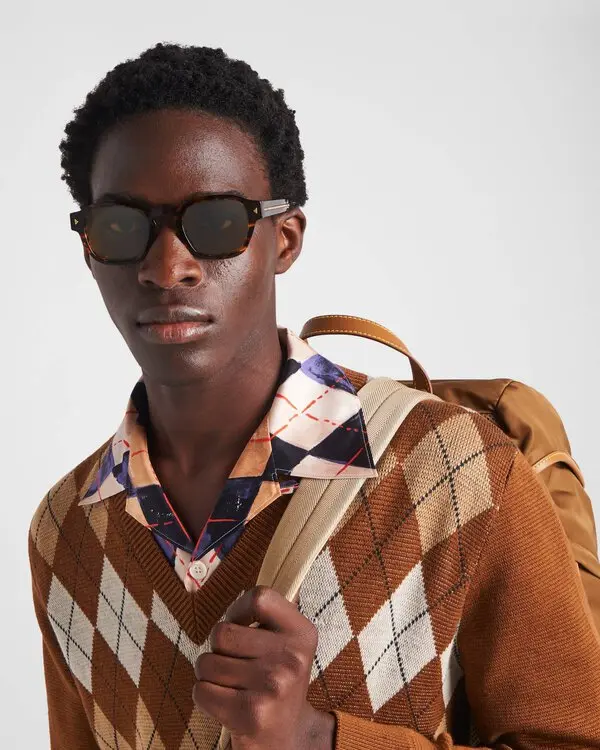 Prada Sunglasses With Iconic Metal Plaque And Triangular Rivets