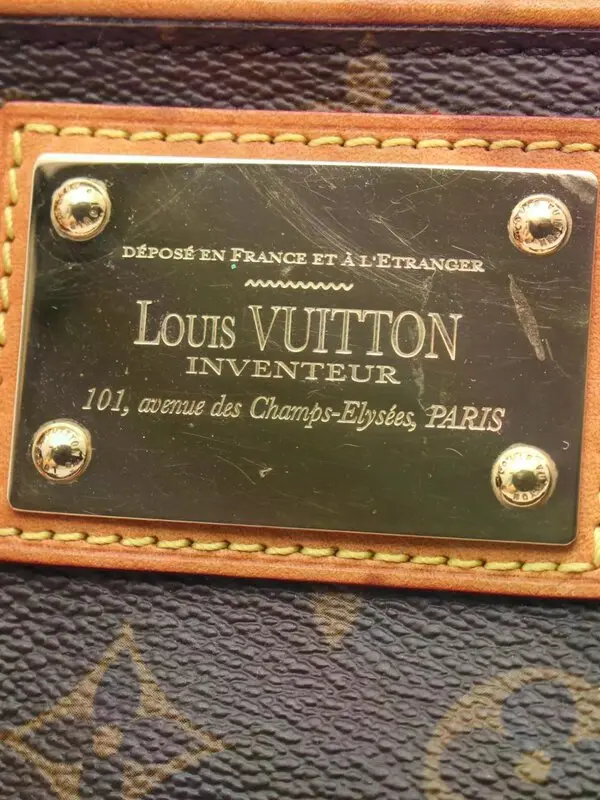 LOUIS VUITTON Monogram Rivet Pochette Handbag