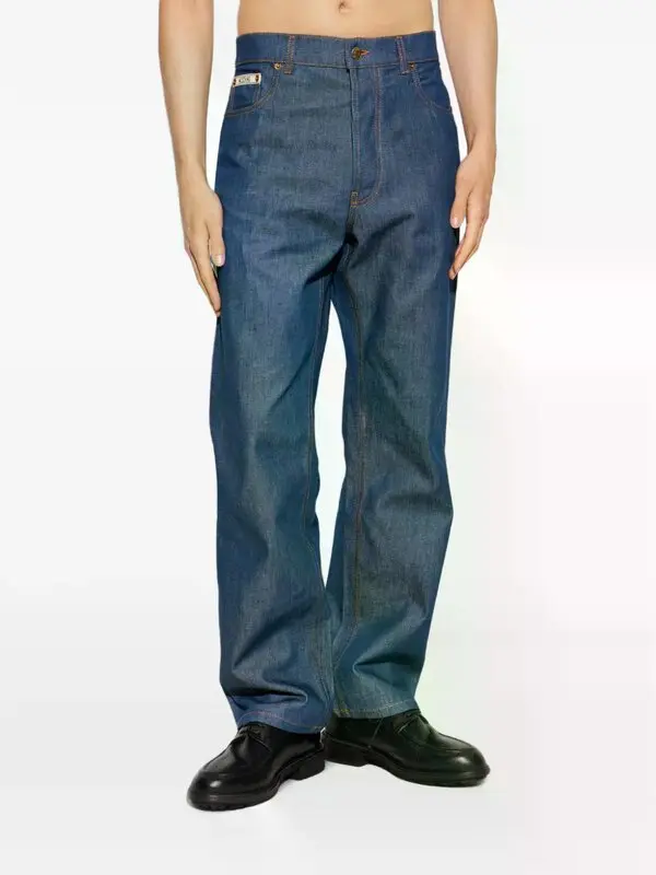 Moschino Tapered-leg Jeans With Logo Patch