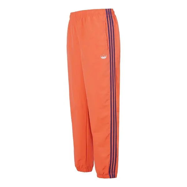 Adidas Originals Woven Three Stripe Warm Up Pants - Orange