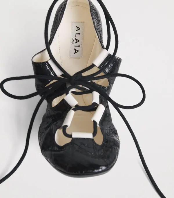 Alaïa Snakeskin Lace-up Ballet Flats - Clear