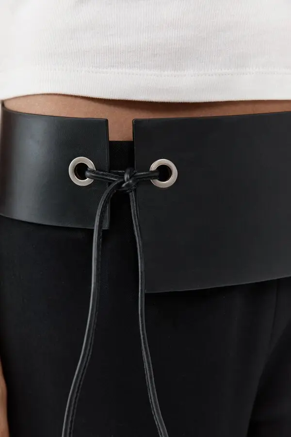 ST. AGNI Asymmetric Leather Belt With Silver Eyelets And Tie Detail