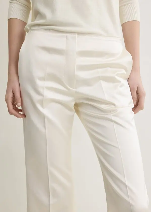 TOTEME Kick Flare Raw-edge Trousers