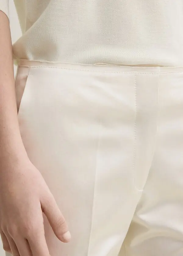 TOTEME Kick Flare Raw-edge Trousers