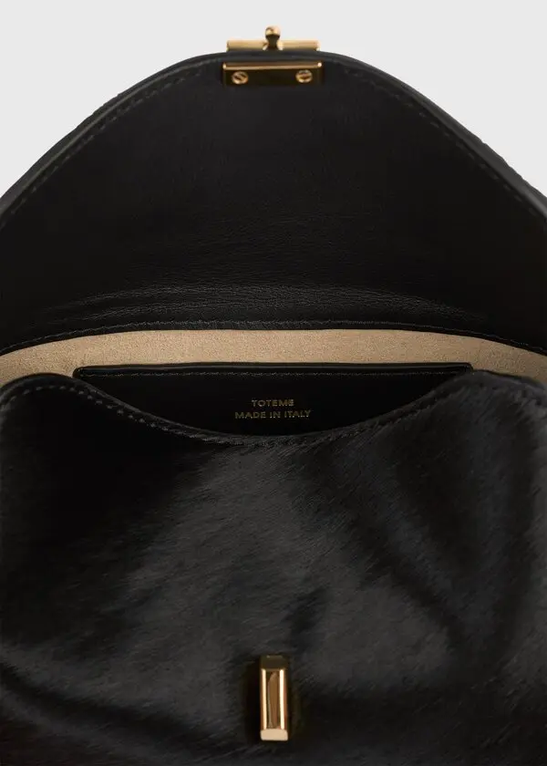 TOTEME Mini T-lock Pony Hair Clutch