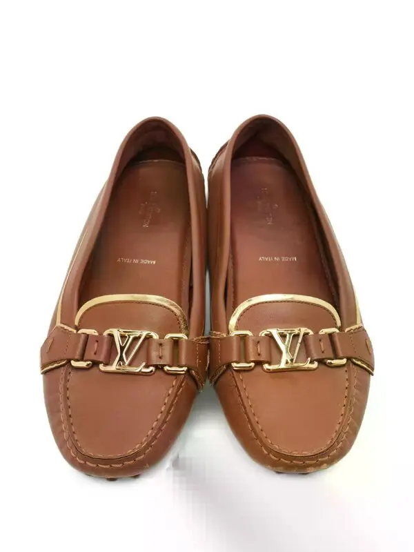 LOUIS VUITTON Leather Loafers With Logo Plaque