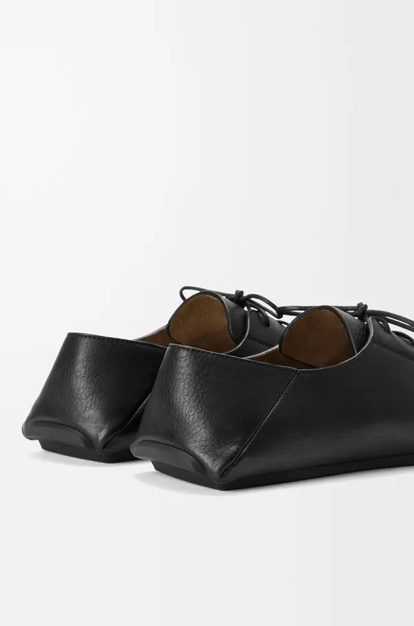 Loewe Wearing Loafers Over Other Shoes