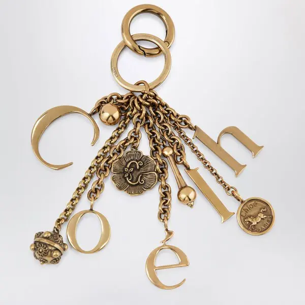 Chloé Bag Charm With Logo And Symbols In Vintage Gold Brass - Silver