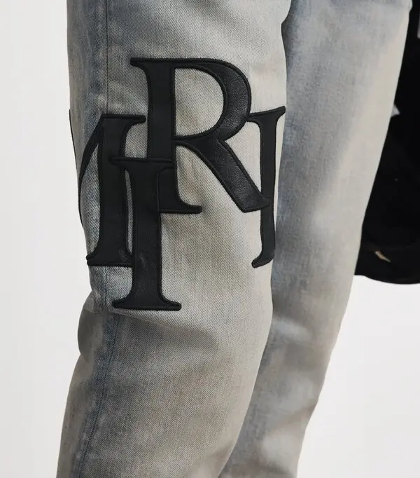 Amiri Staggered Logo Skinny Jeans