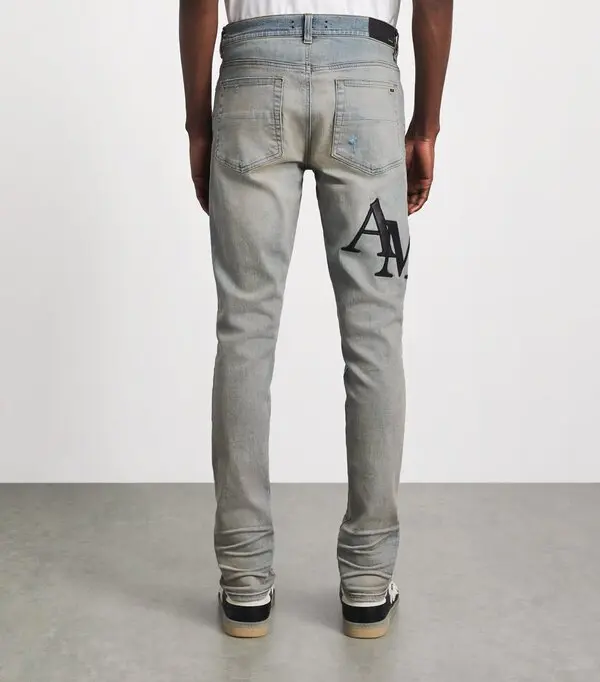 Amiri Staggered Logo Skinny Jeans