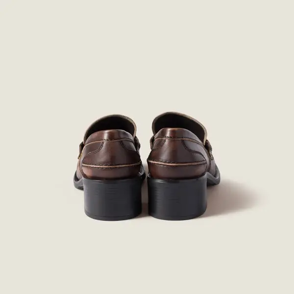 Miu Miu Logo-embossed Penny Loafers