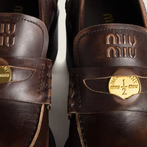 Miu Miu Logo-embossed Penny Loafers
