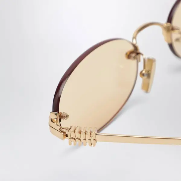 Miu Miu Oval Sunglasses In Gold Tone