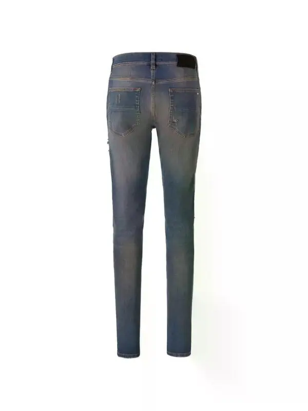 Amiri Distressed Ribbed-panel Jeans